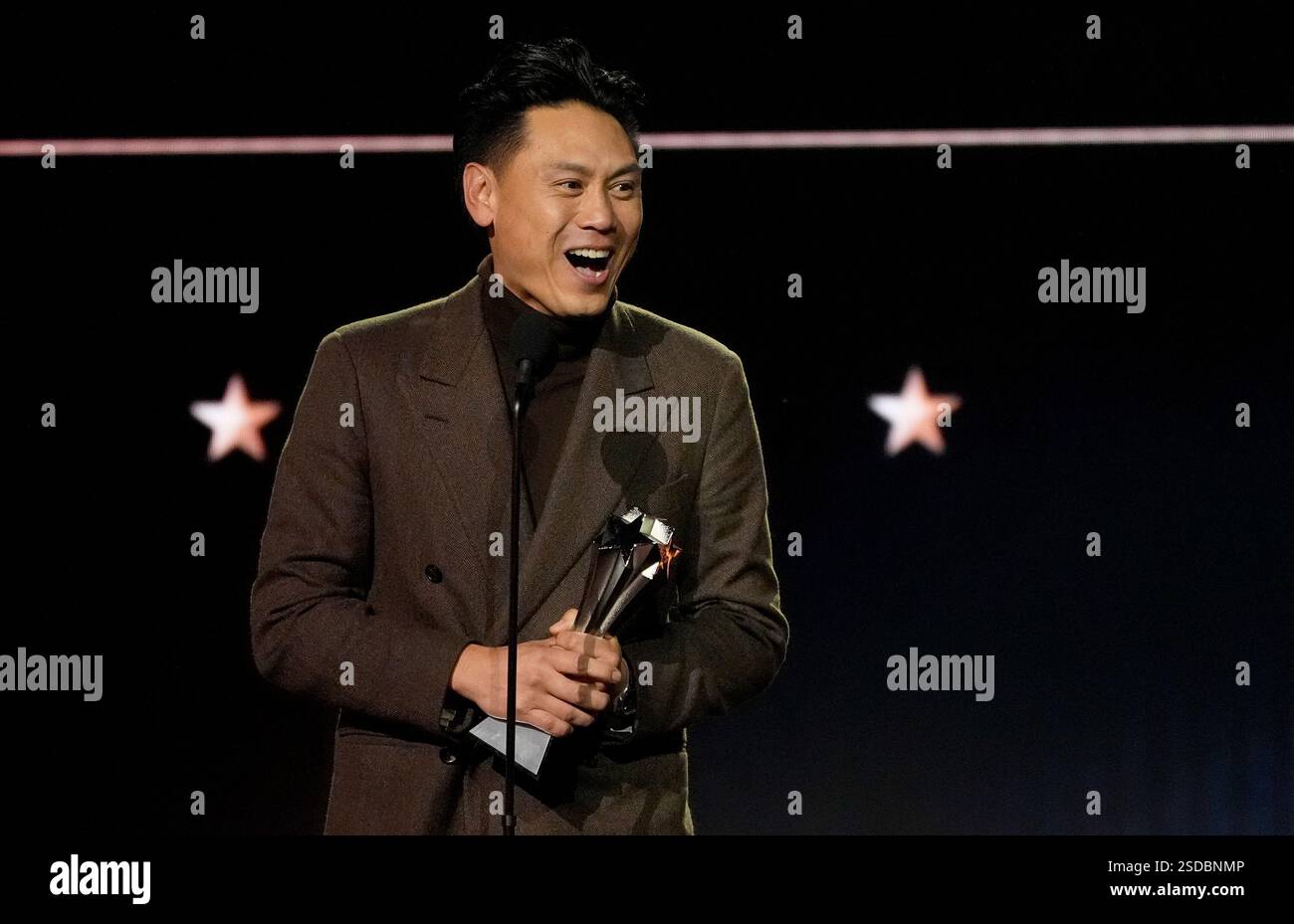 Jon M. Chu accepts the award for best director for "Wicked" during the ...
