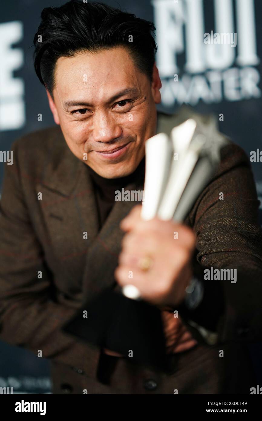 Jon M. Chu poses with the award for best director for "Wicked" in the ...