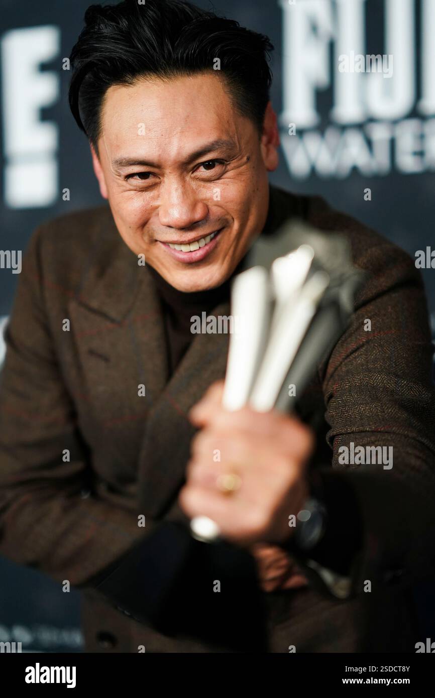 Jon M. Chu poses with the award for best director for "Wicked" in the ...