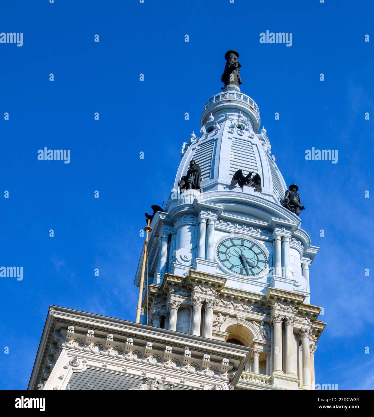 Clock tower with ornate architecture stands tall under clear sky Stock ...