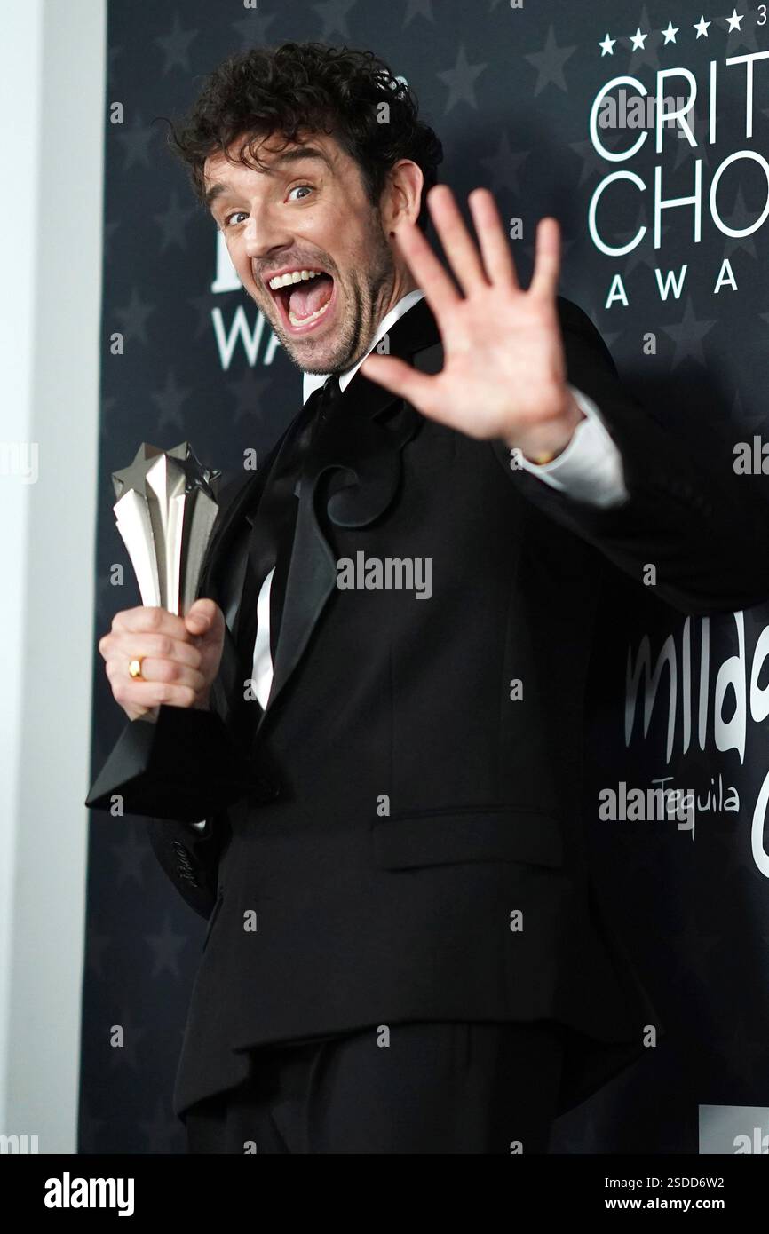 Michael Urie poses in the press room with the award for best supporting ...