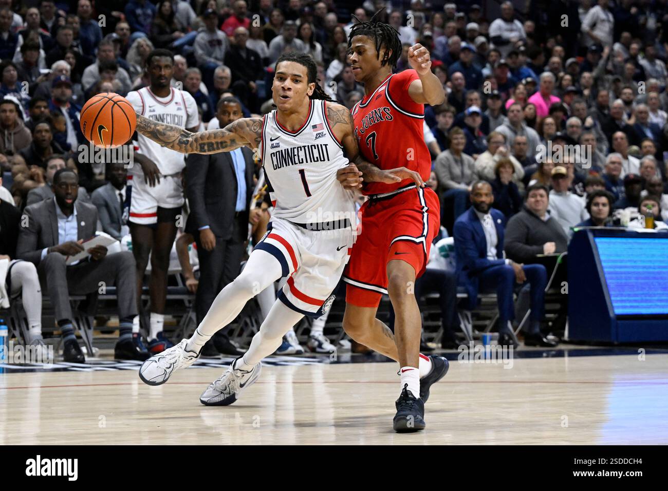 UConn guard Solo Ball (1) is guarded by St. John's guard Simeon Wilcher ...