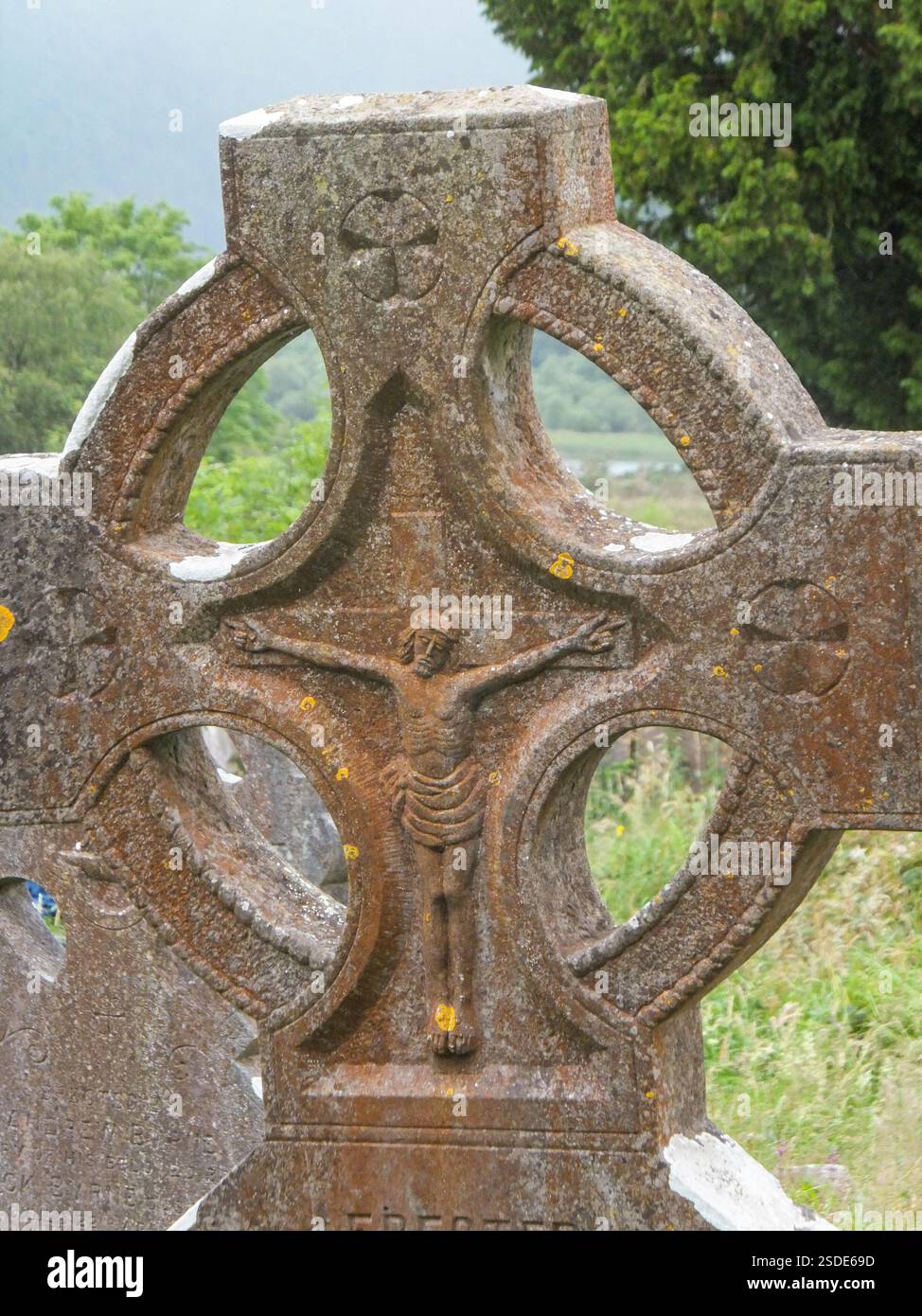 A Celtic cross with a depiction of Jesus Christ being crucified stands ...