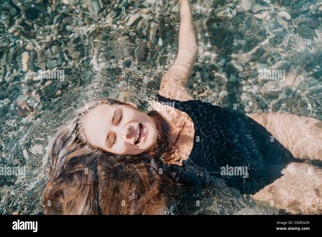 Body submerged in pool hi-res stock photography and images - Alamy