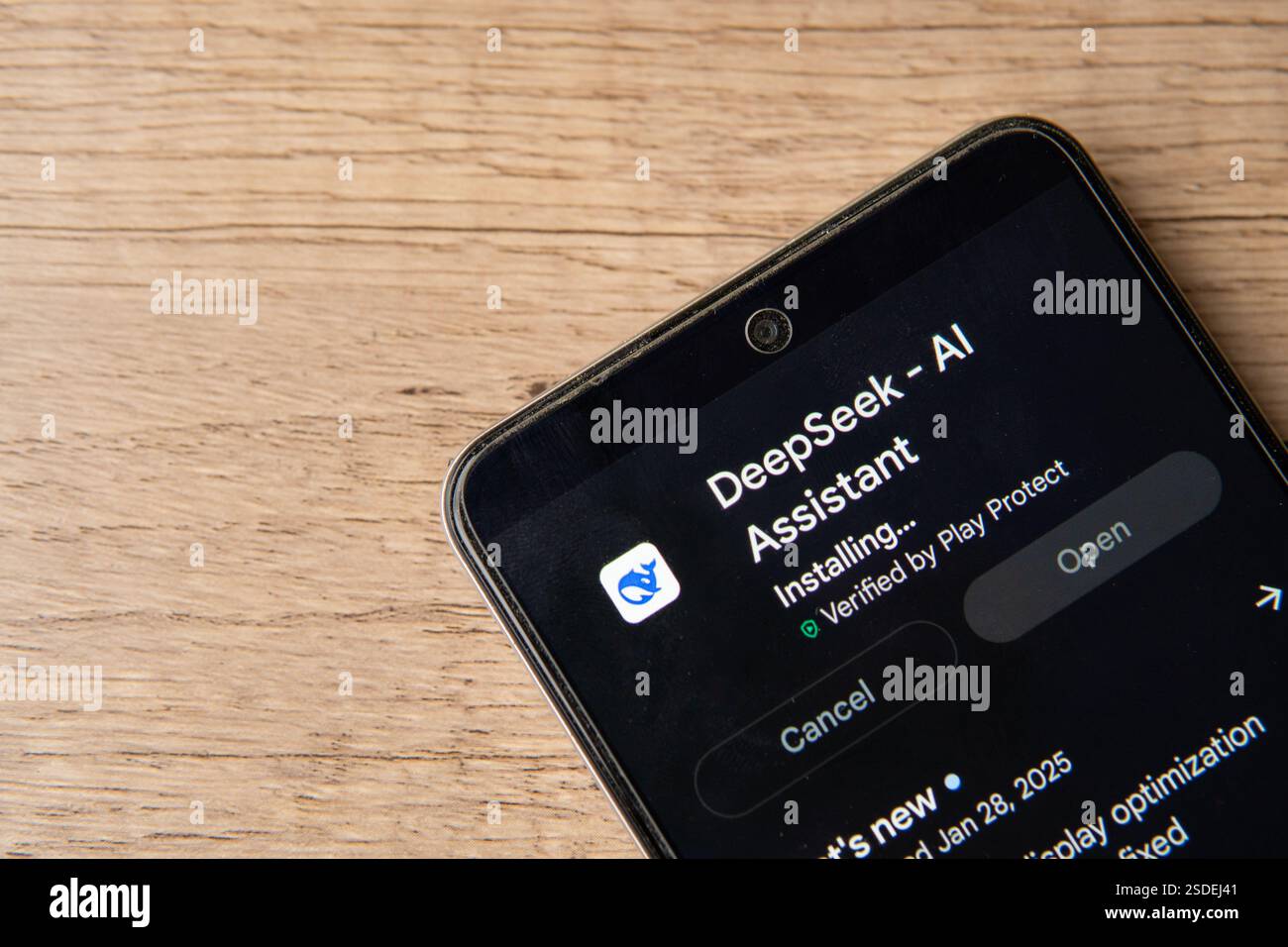 A smartphone screen displaying the installation progress of the DeepSeek AI Assistant app Stock ...