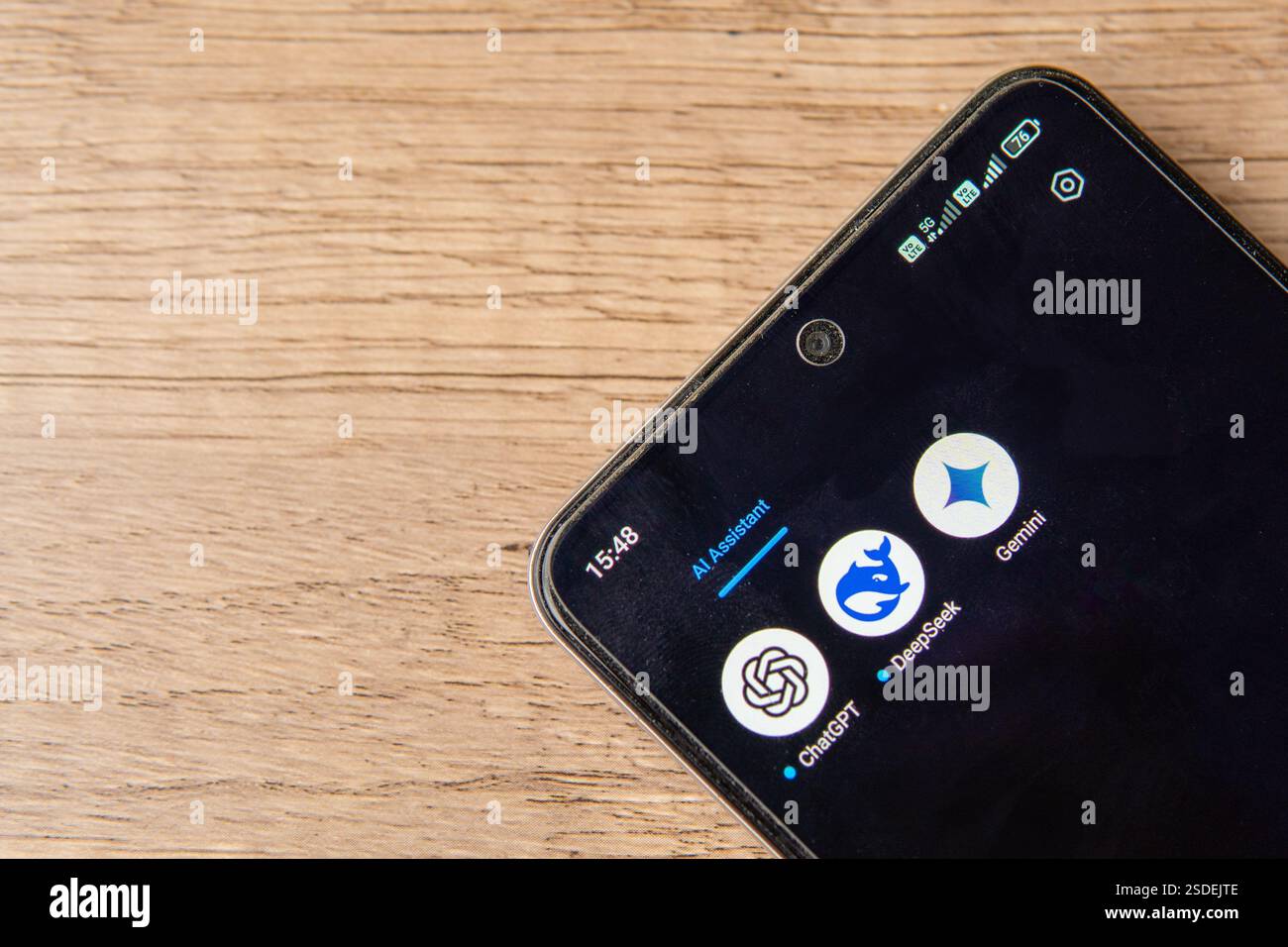 A close-up image of a smartphone screen displaying AI assistant logos ...
