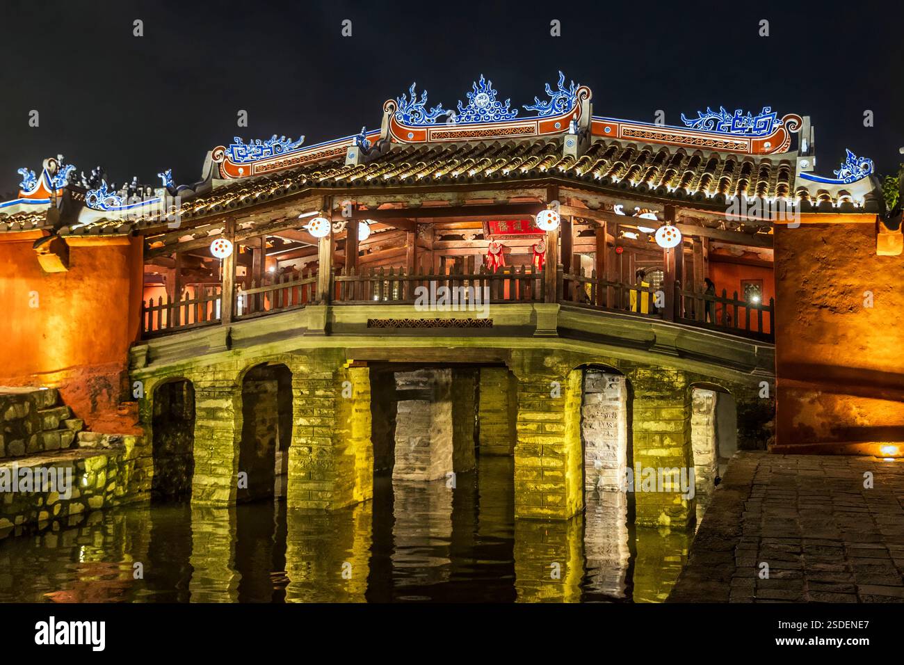 Japanese Covered Bridge illuminated at night in Hoi An, Vietnam ...
