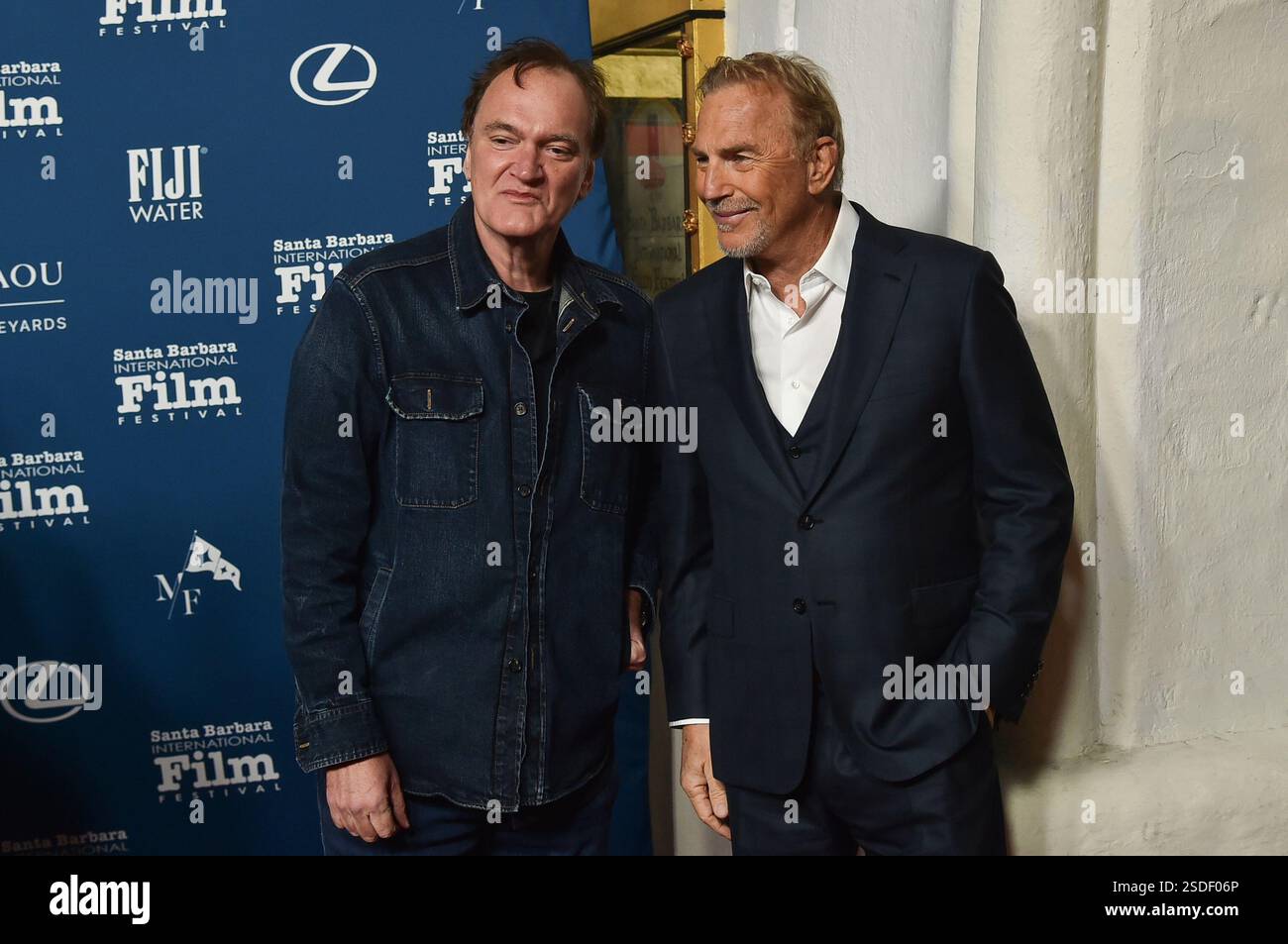 Quentin Tarantino, left, and Kevin Costner attend the premiere of ...