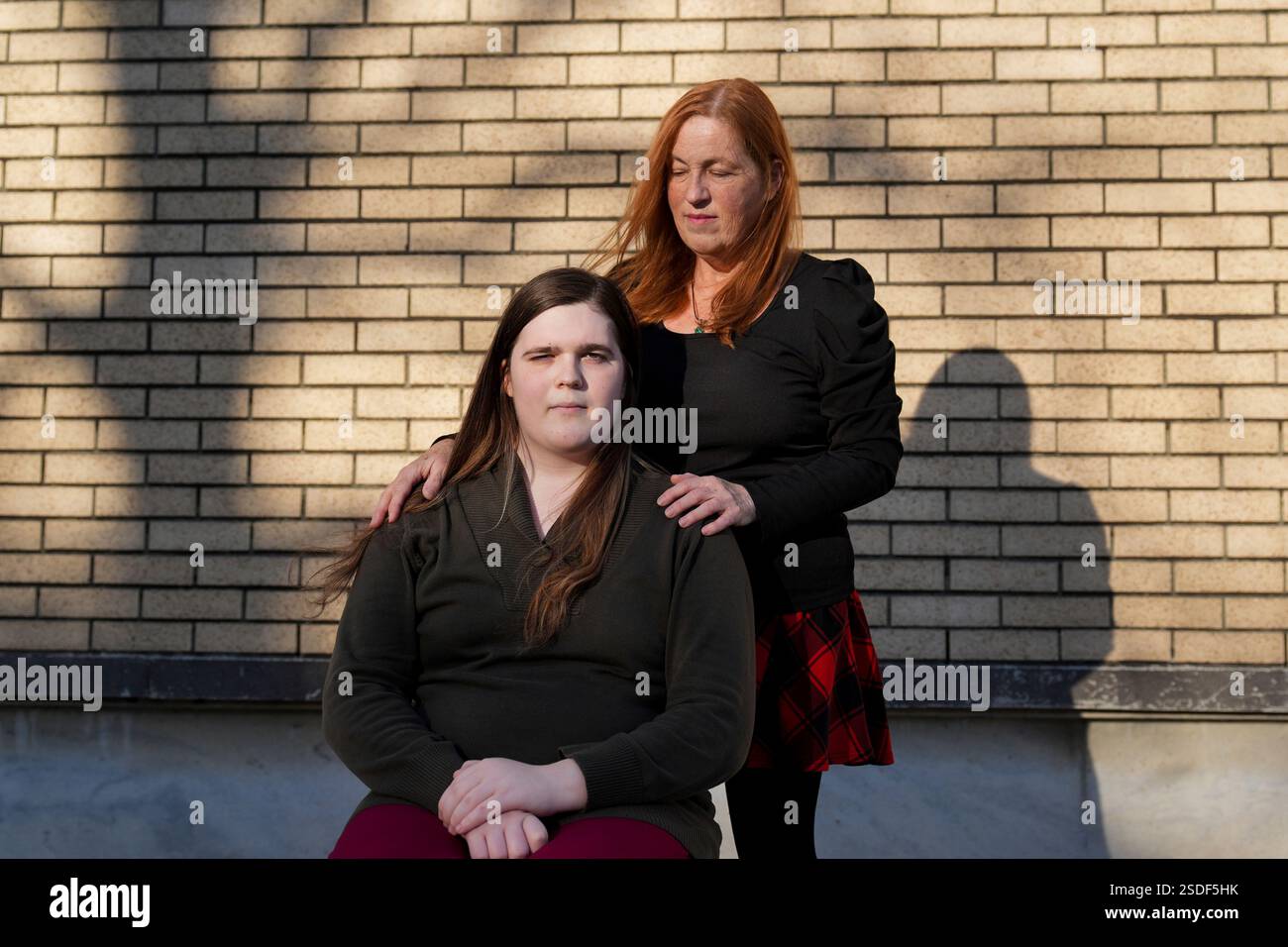 Mellow, a transgender woman, left, poses for a portrait with her mother ...
