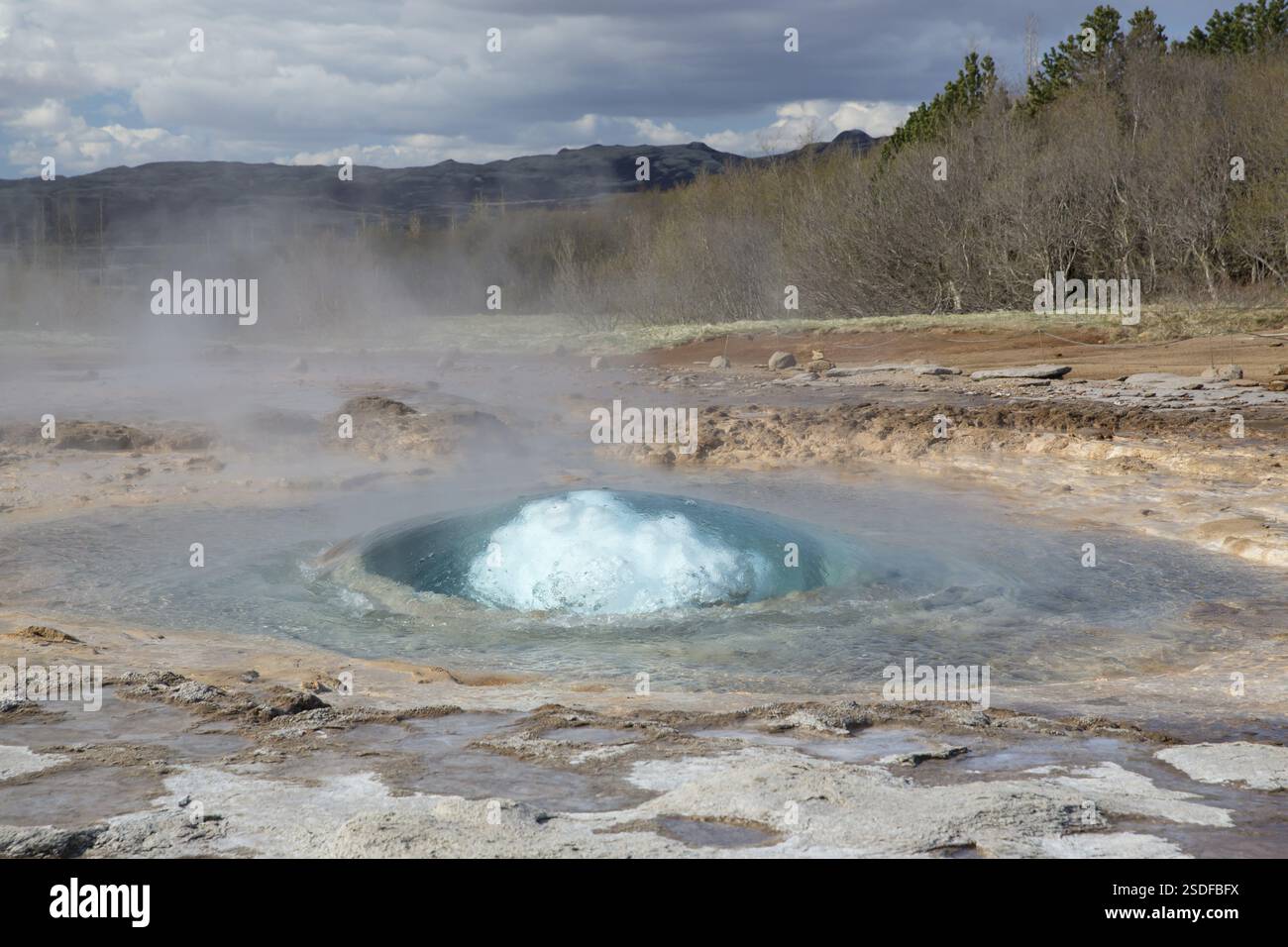 Strokkur is a fountain geyser located in a geothermal area in the ...