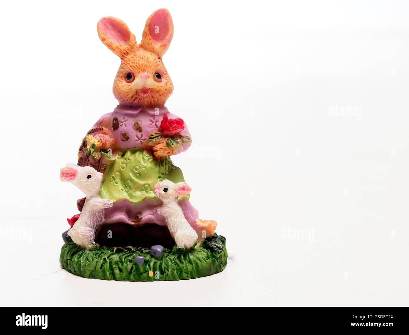 Antique Easter figurine depicting a mother rabbit in a dress with two ...