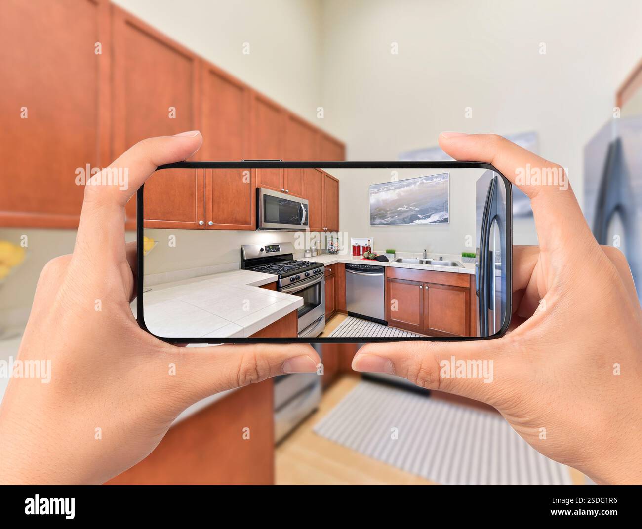 Cell phone taking a picture of a modern residential kitchen interior ...
