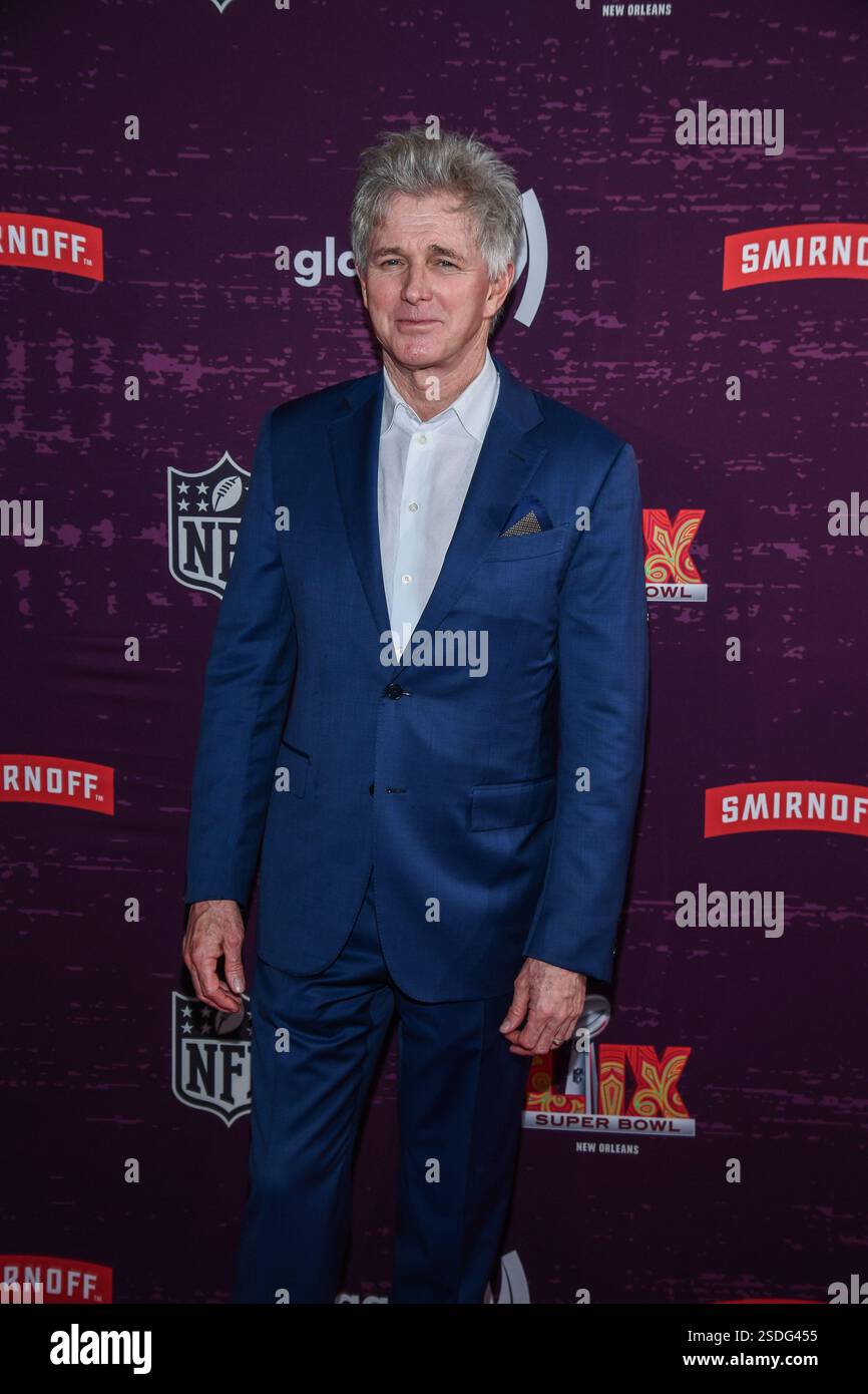 Tim Ellis walking on the red carpet at the NFL Night of Pride with ...