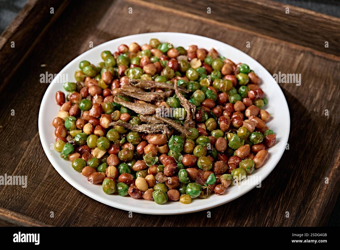 Crispy fried green beans, peanuts and dried fish with salt Stock Photo ...