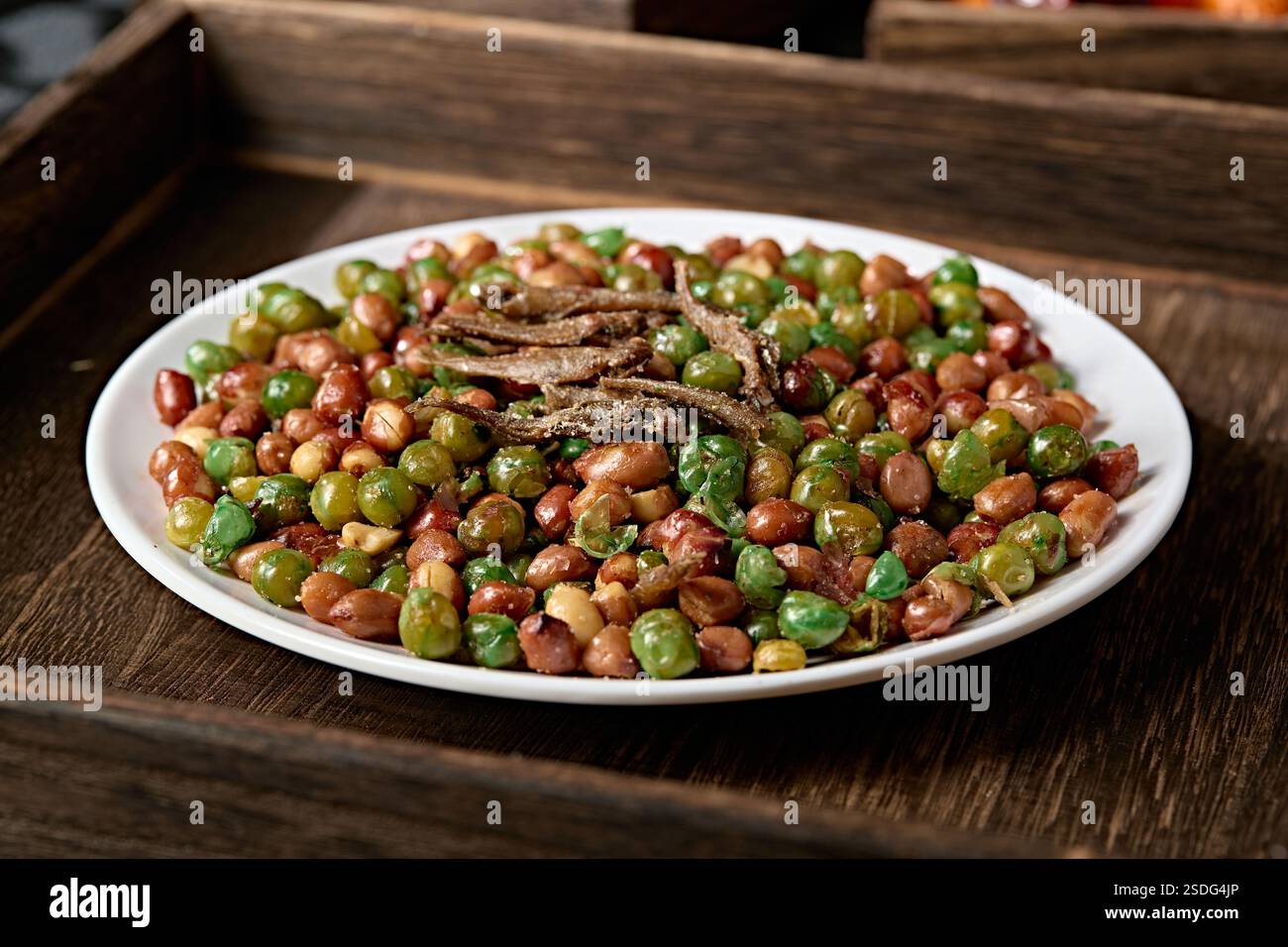 Crispy fried green beans, peanuts and dried fish with salt Stock Photo ...