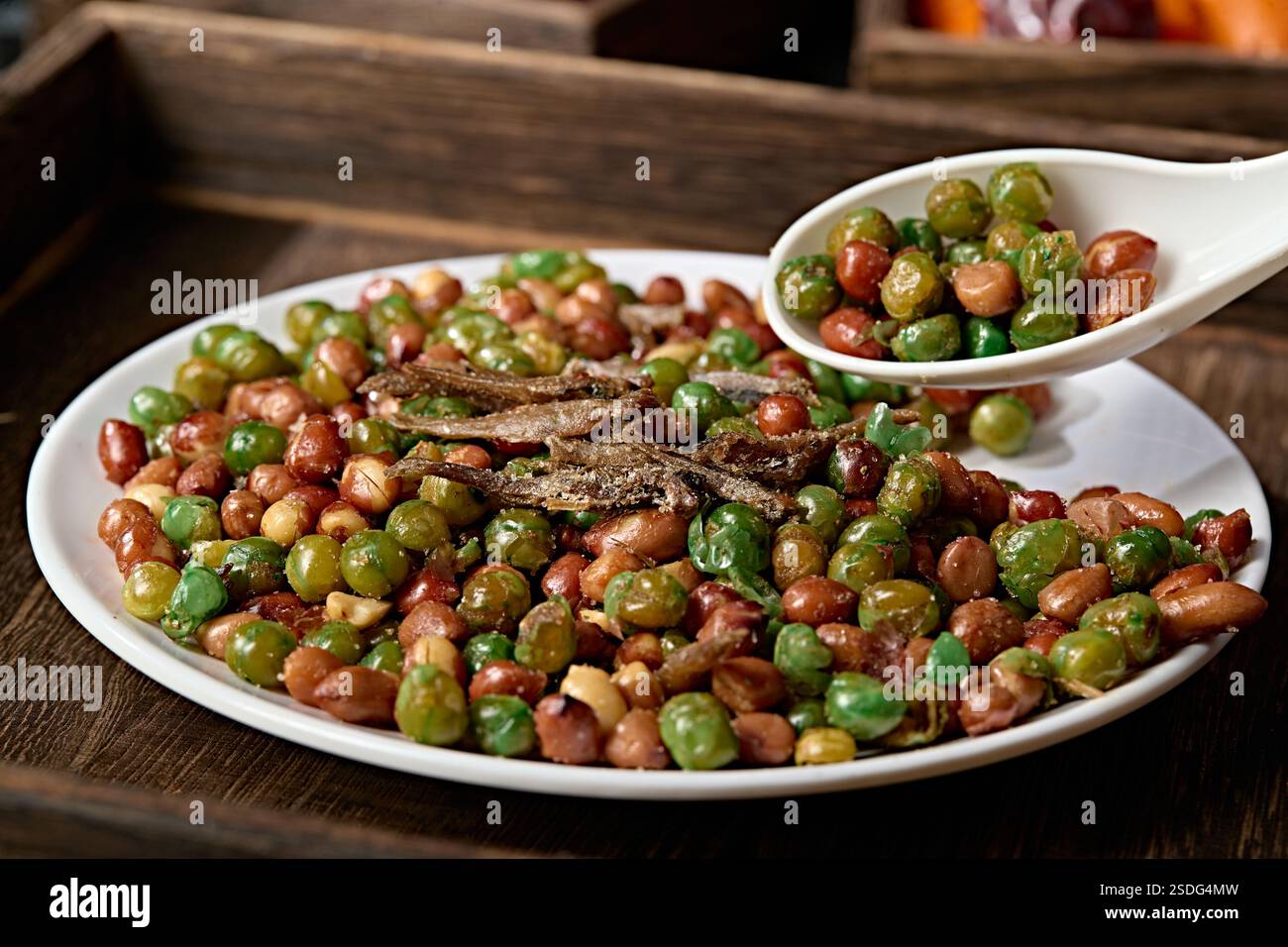 Crispy fried green beans, peanuts and dried fish with salt Stock Photo ...