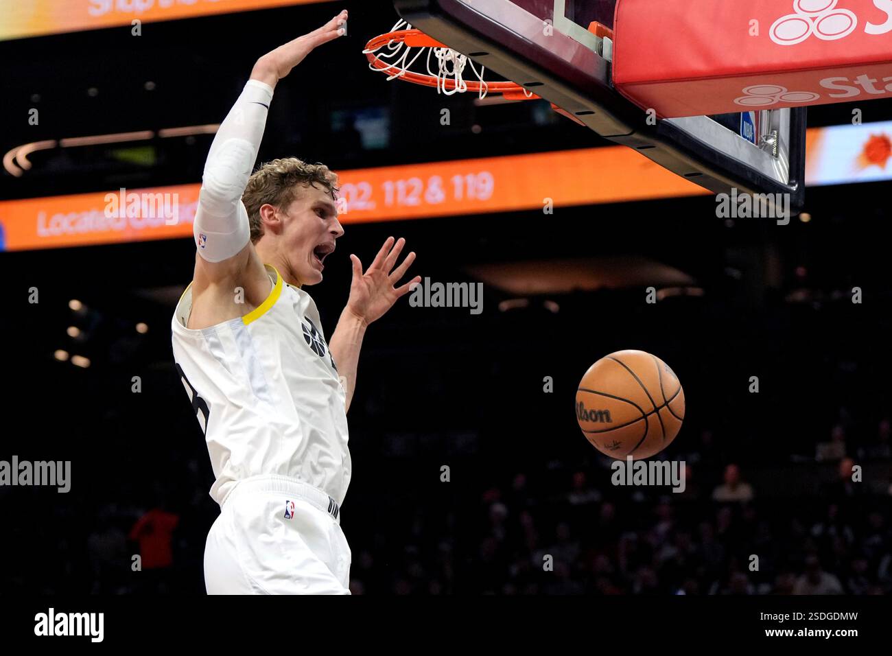Utah Jazz forward Lauri Markkanen dunks against the Phoenix Suns during the second half of an ...