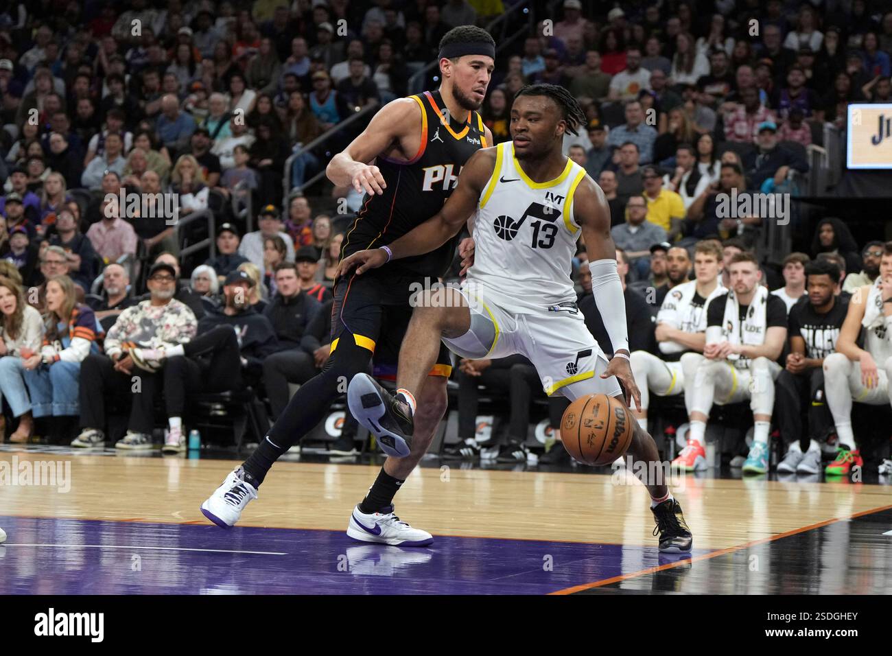 Utah Jazz guard Isaiah Collier (13) shields the ball from Phoenix Suns ...