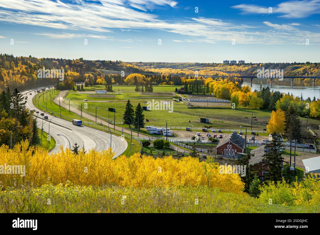 View to a equine centre located in river valley framed with bent road ...