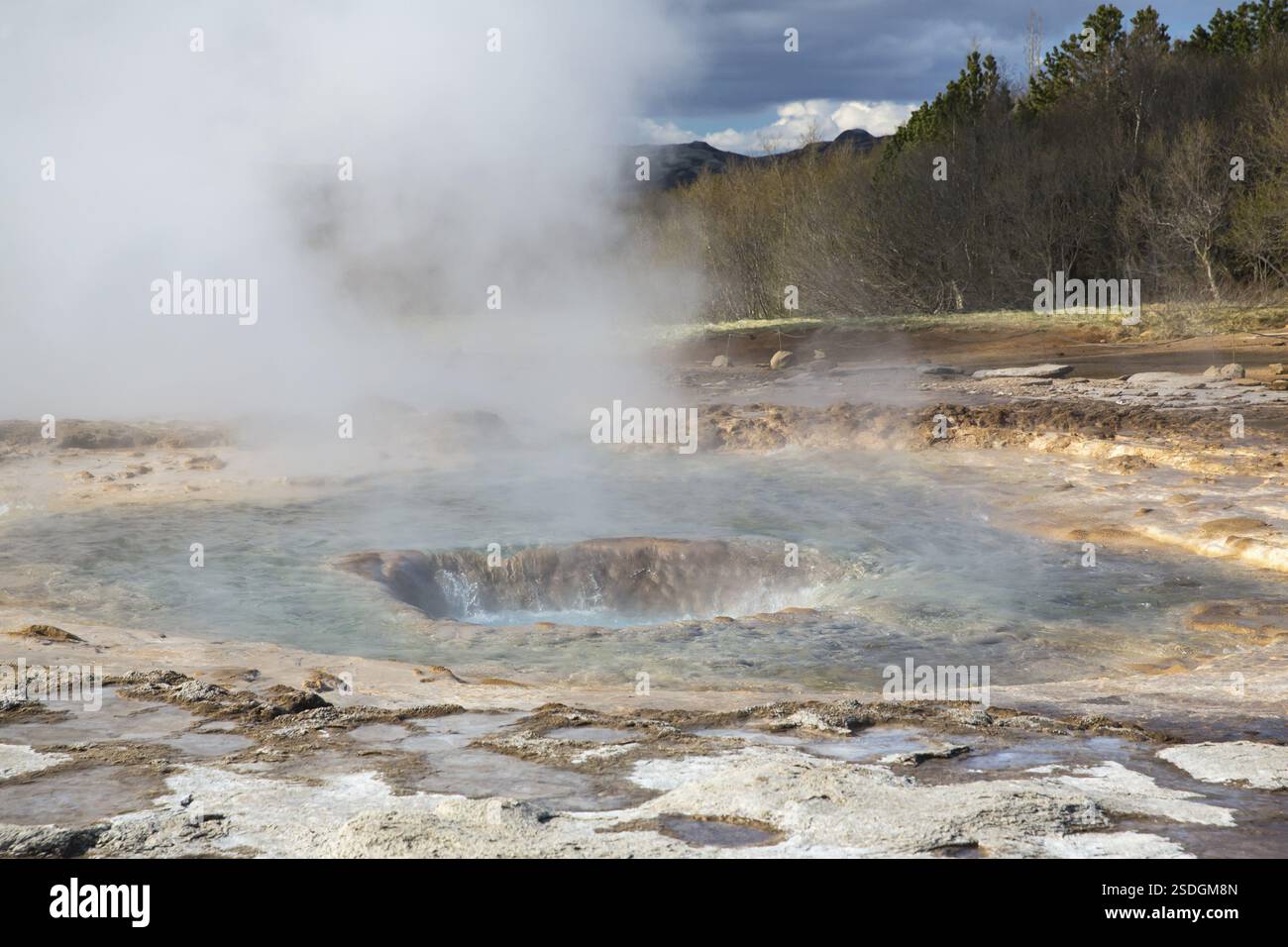 Strokkur is a fountain geyser located in a geothermal area in the ...