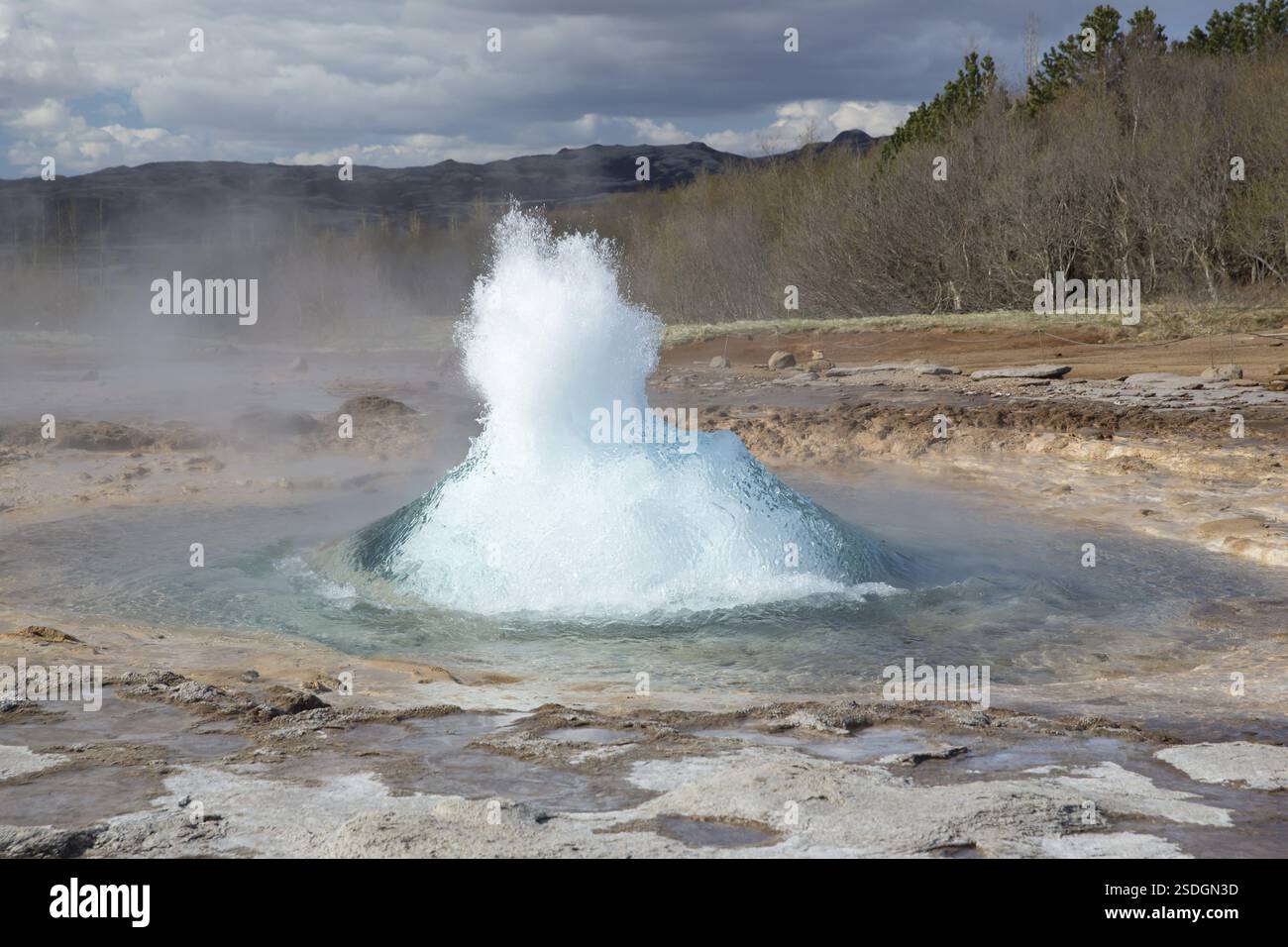 Strokkur is a fountain geyser located in a geothermal area in the ...