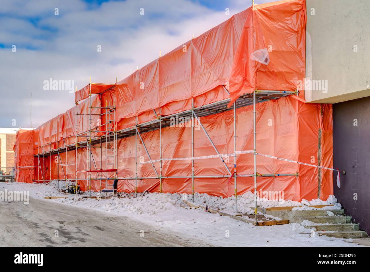 Scaffolding and duct control coverage in preparation for building ...