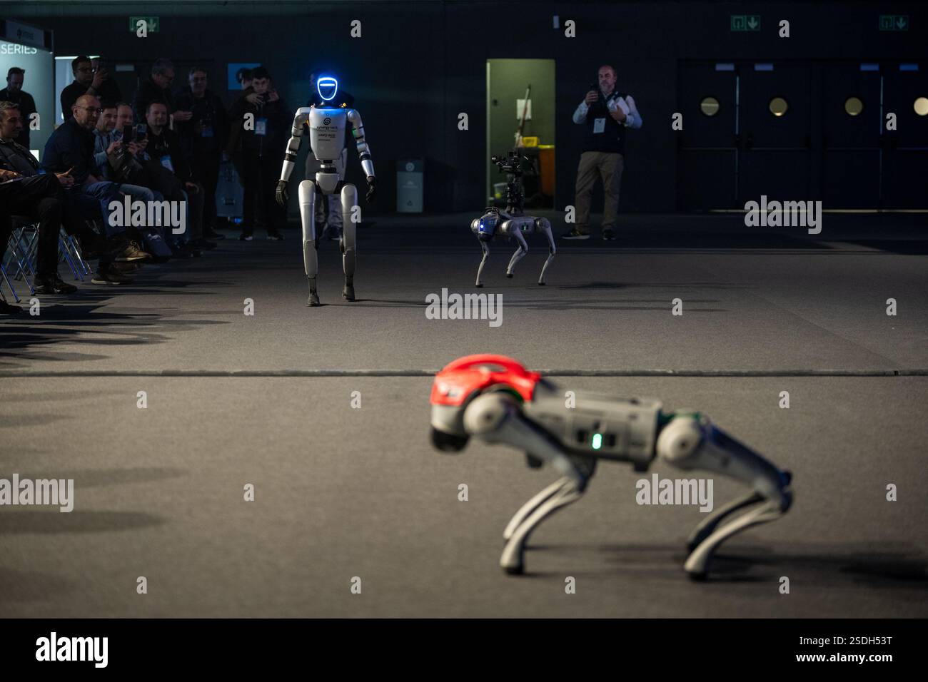 Beijing, Spain. 6th Feb, 2025. People watch robots on display during ...