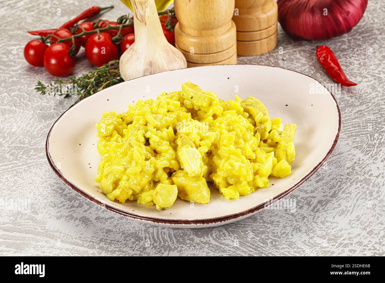 Italian cuisine - yellow risotto with chicken and soft cheese Stock ...