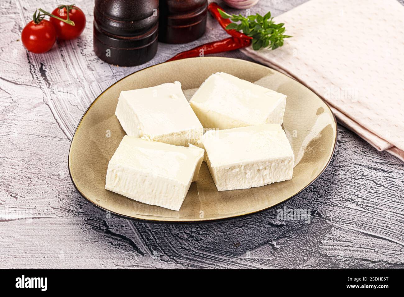 Greek traditional cuisine - Feta cheese bricks Stock Photo - Alamy