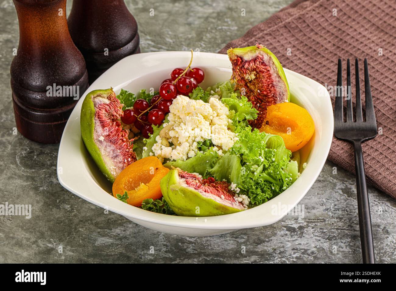 Salad with fig and sheep cottage cheese Stock Photo - Alamy