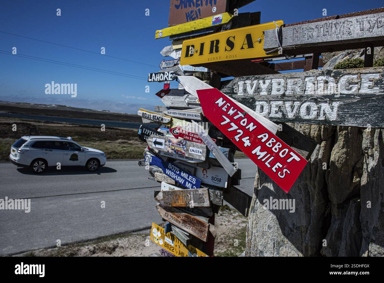 Totem with distance signs on a street in Stanley, Falkland Islands ...