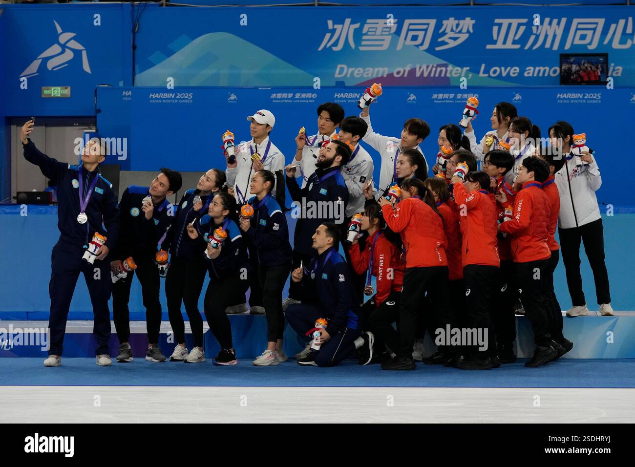 Silver medalist Kazakhstan, gold medalist South Korea and bronze medalist Japan pose for a ...