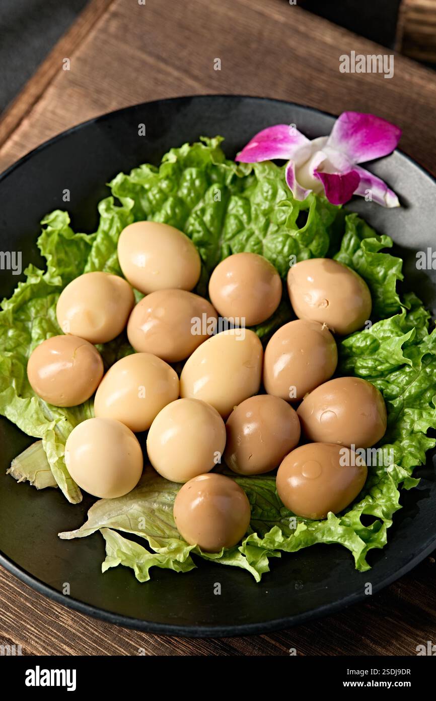 Snack brine quail eggs Stock Photo - Alamy