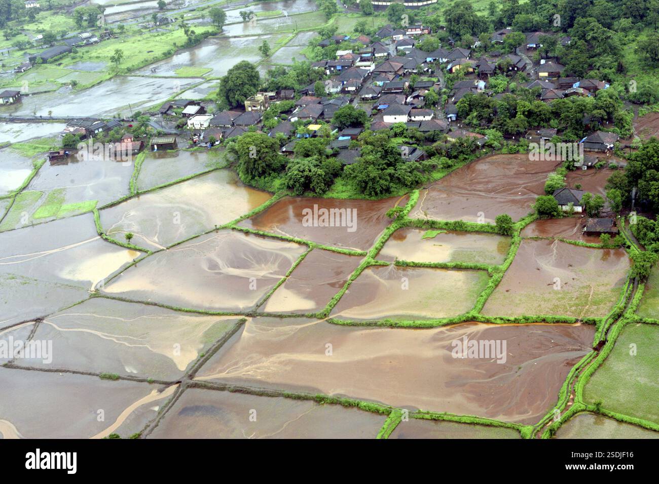 An aerial view of entire village and farming land immersed in water ...