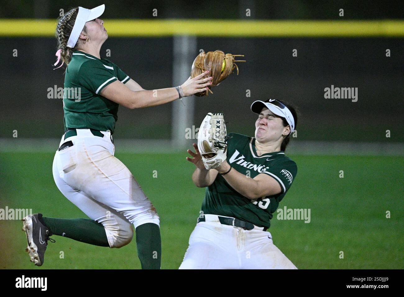 Cleveland State infielder Delaney Ellis, left, catches a fly ball in ...