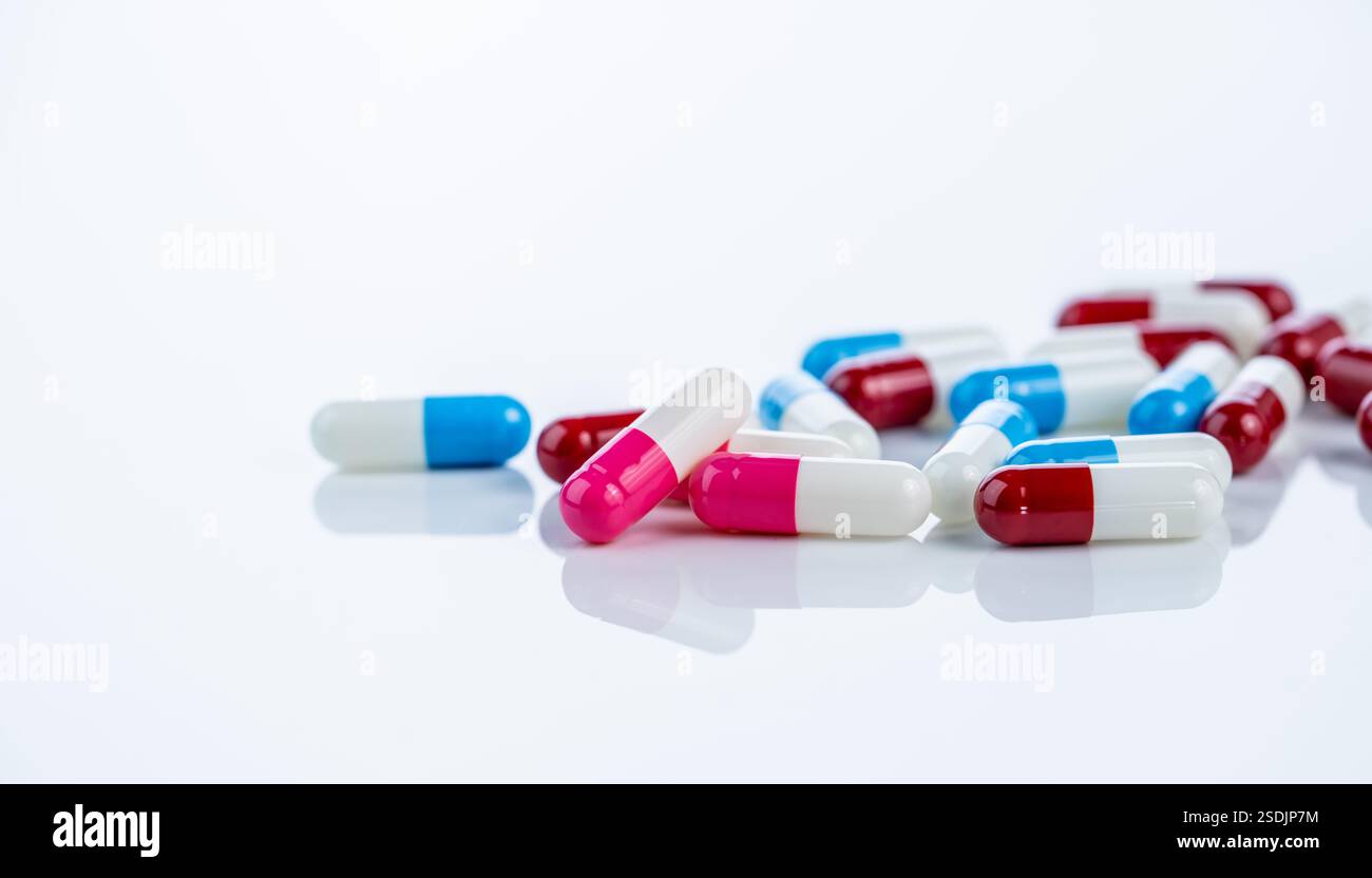 Colorful capsule pills on white background. Healthcare and ...
