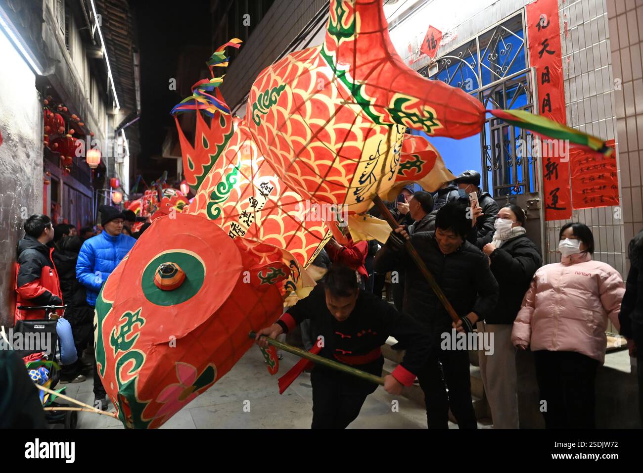 Huangshan,China.7th February 2025. Folk artists perform fish-shaped ...