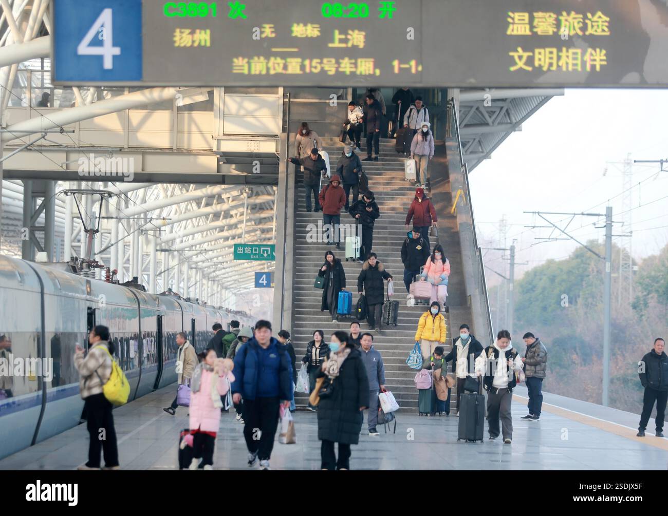 Passengers are seen at Yangzhou railway station in Yangzhou City, east ...