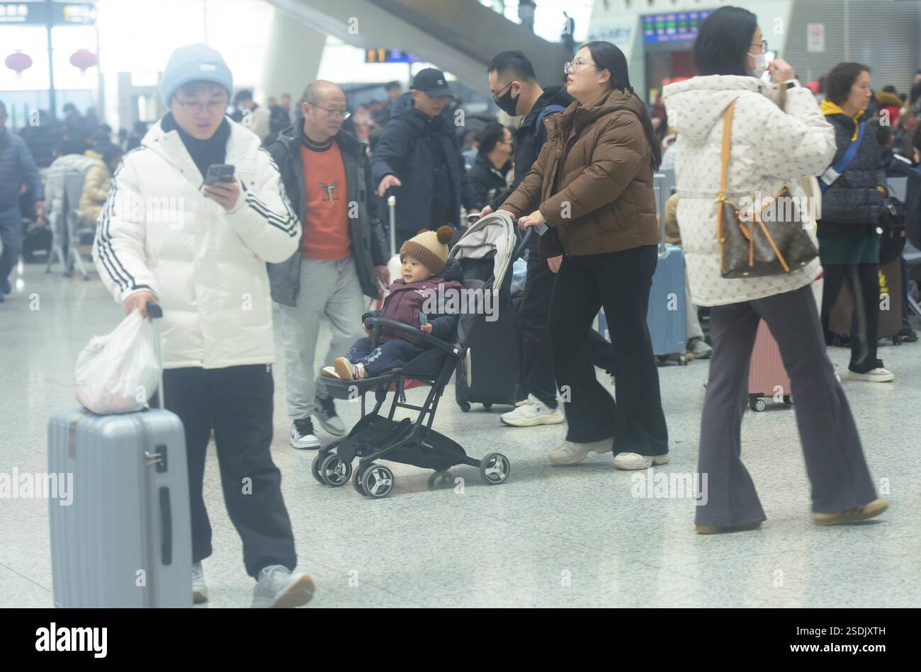 Passengers are seen at Hangzhoudong railway station in Hangzhou City ...