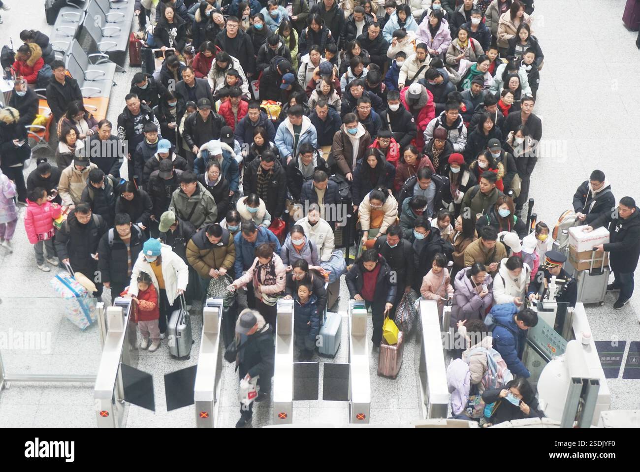 Passengers are seen at Hangzhoudong railway station in Hangzhou City ...