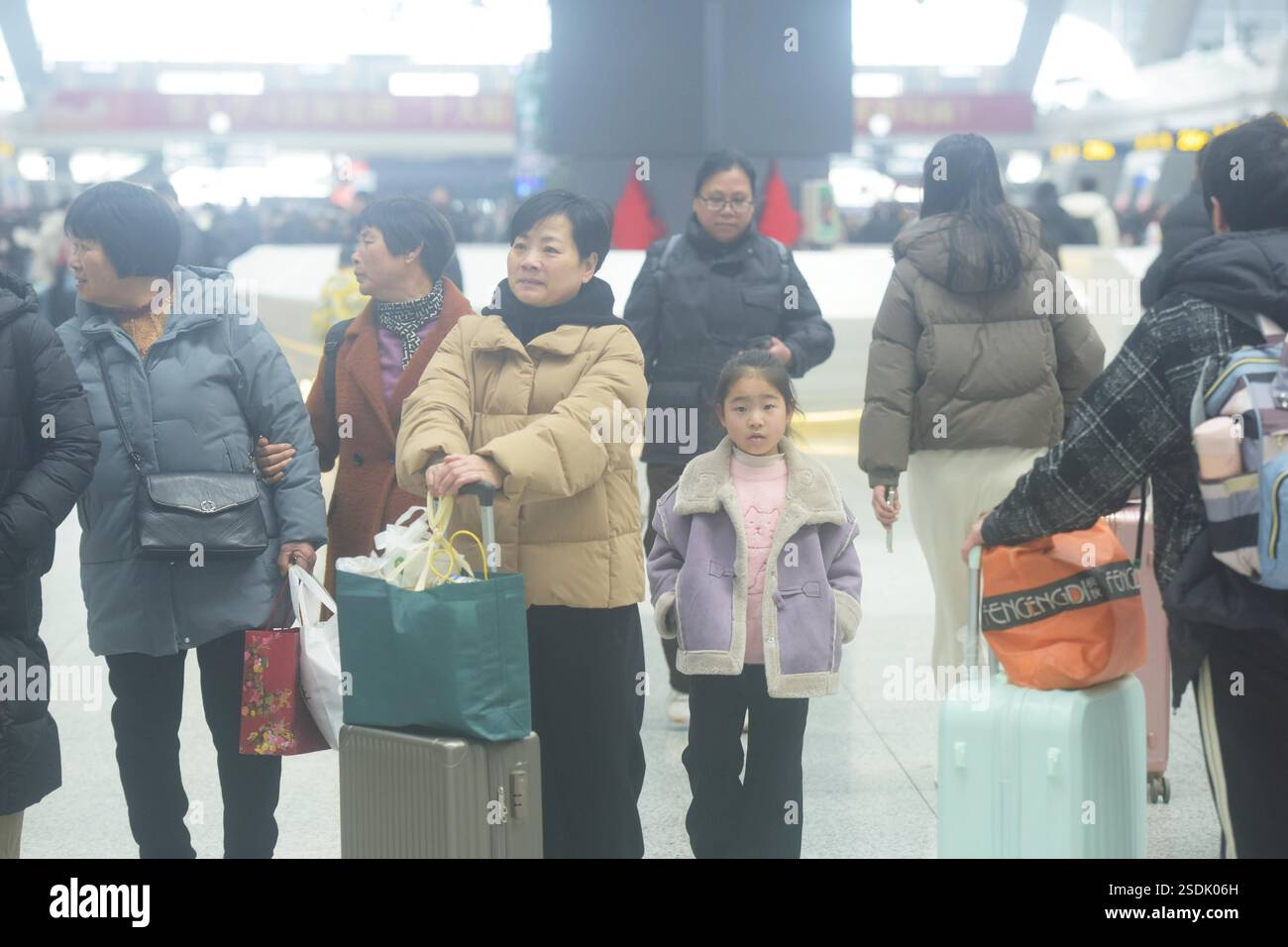 Passengers are seen at Hangzhoudong railway station in Hangzhou City ...