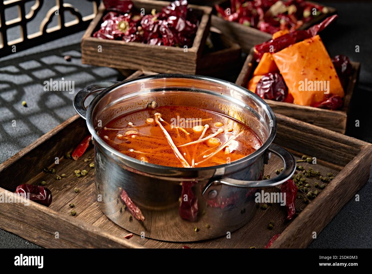 Mini hot pot soup base tomato mushroom soup base Stock Photo - Alamy
