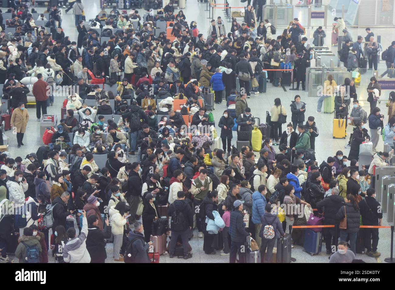 Passengers are seen at Hangzhoudong railway station in Hangzhou City ...