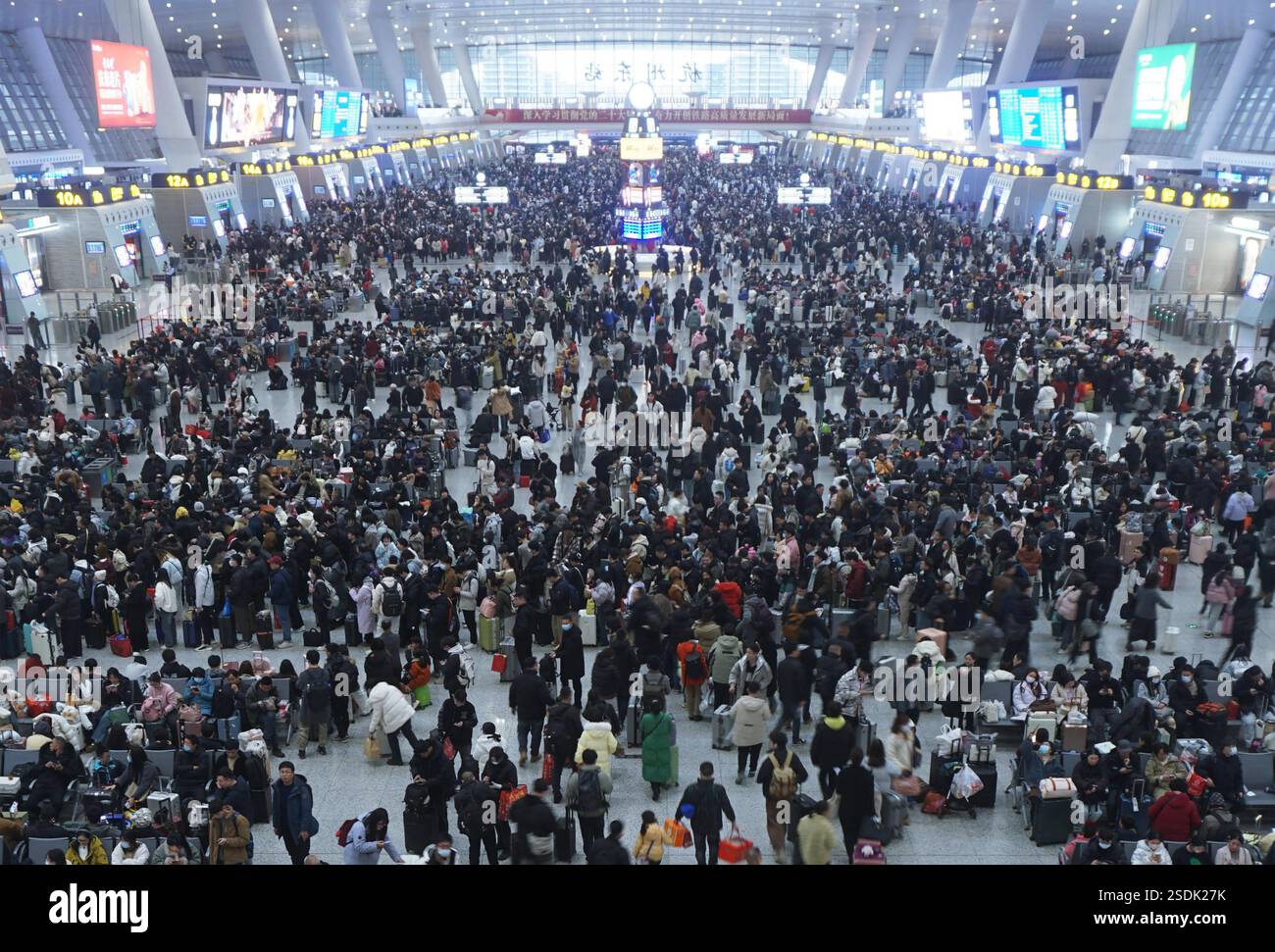 Passengers are seen at Hangzhoudong railway station in Hangzhou City ...