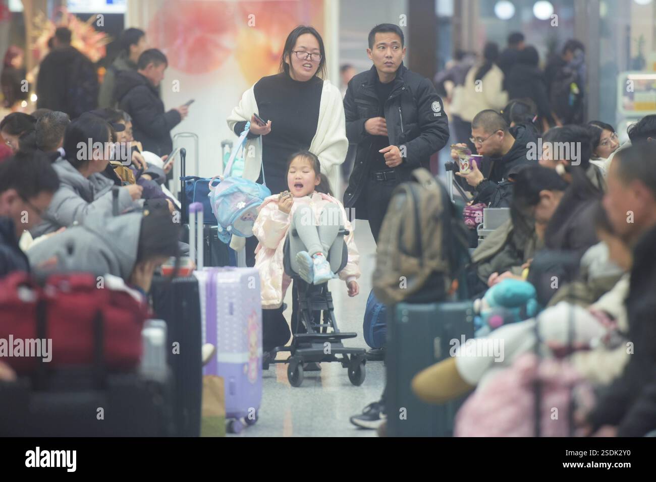 Passengers are seen at Hangzhoudong railway station in Hangzhou City ...