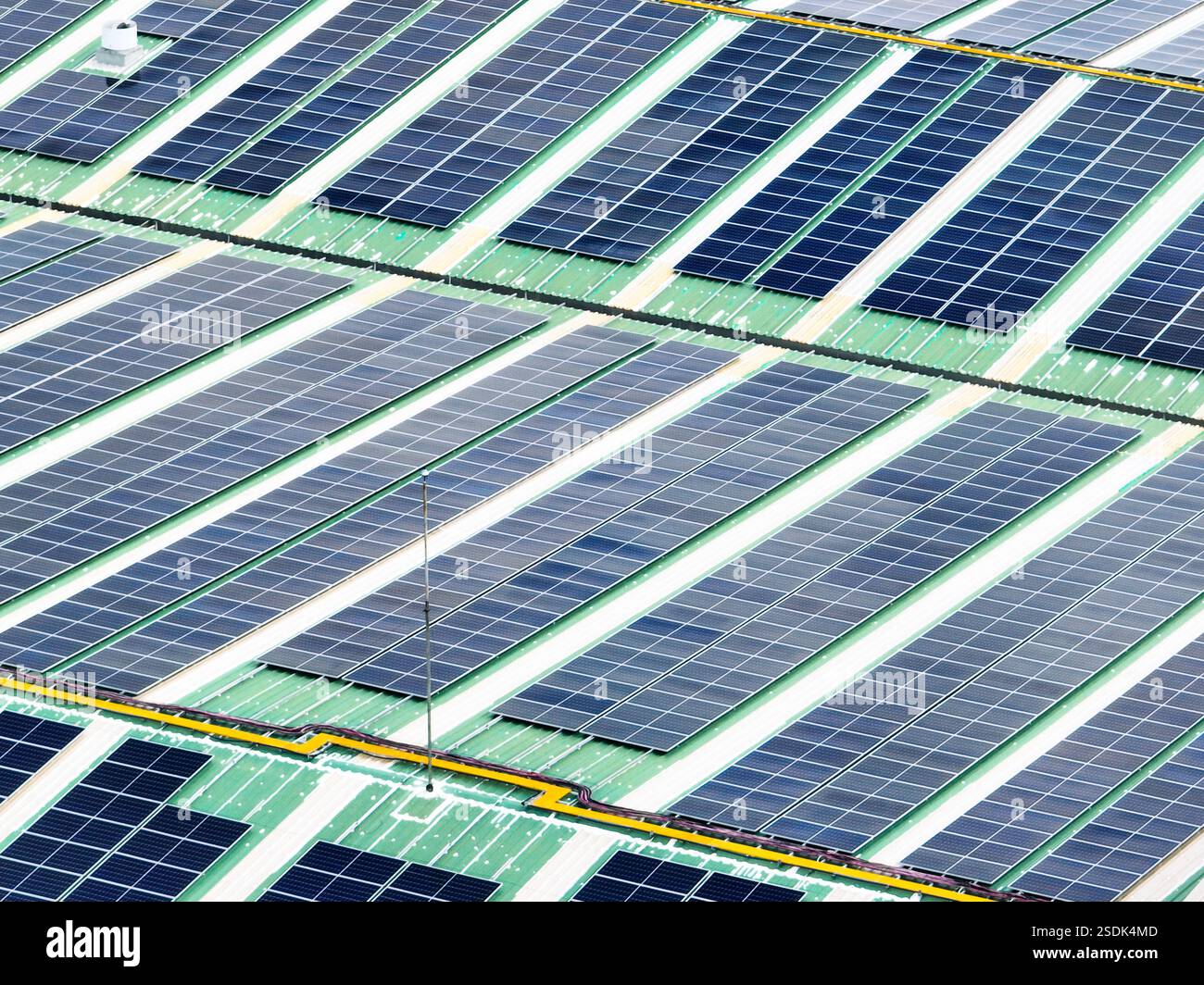 Solar energy system installed on the rooftop of an industrial factory ...