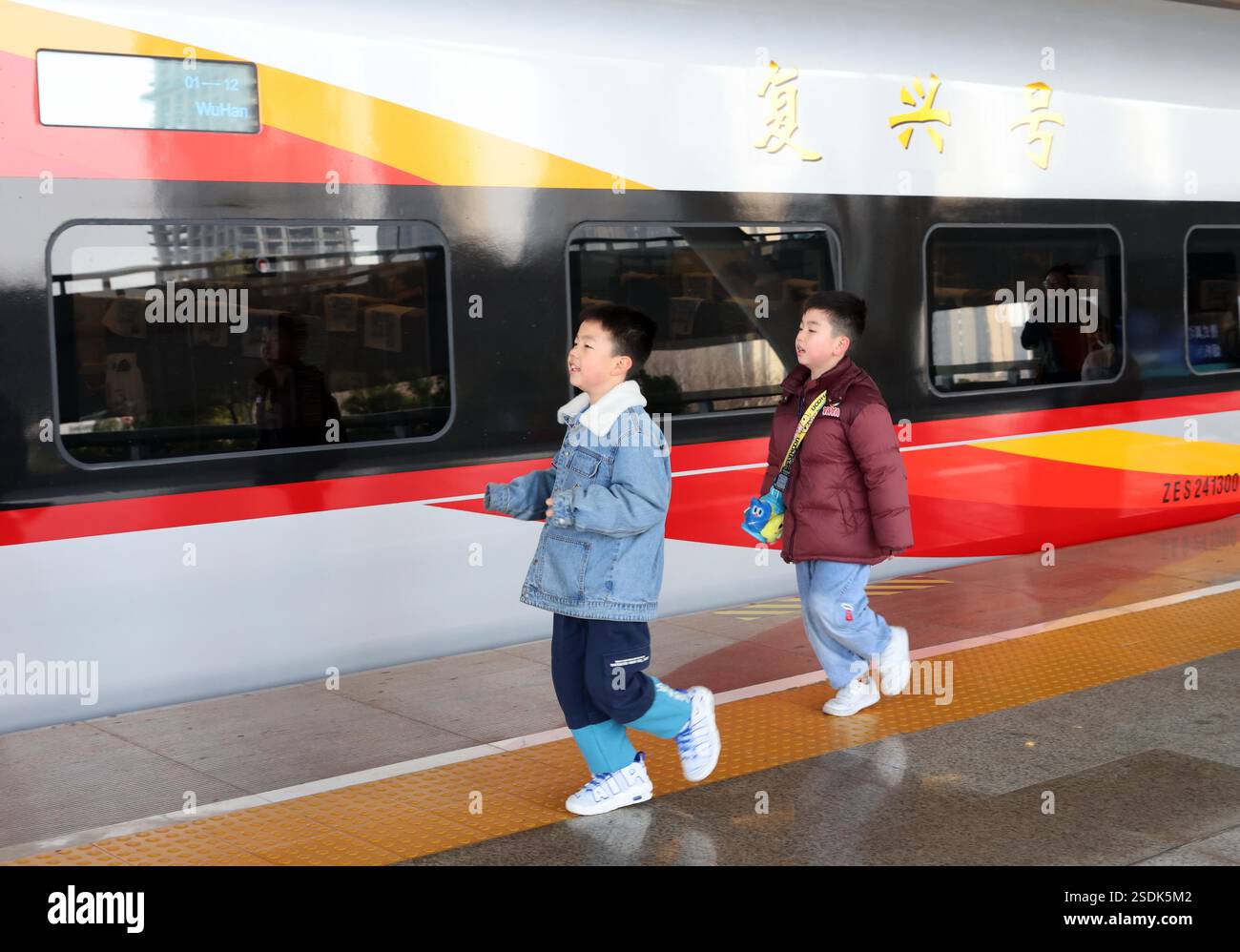 Passengers are seen at Wuhan railway station in Wuhan City, central ...
