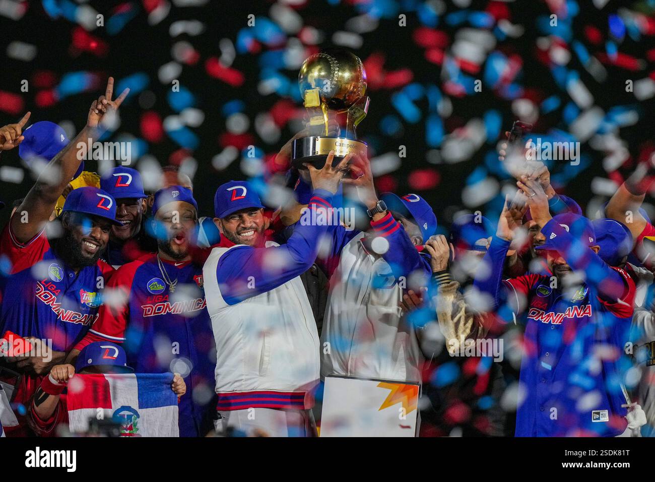 Players of Dominican Republic hold up the trophy after winning the ...