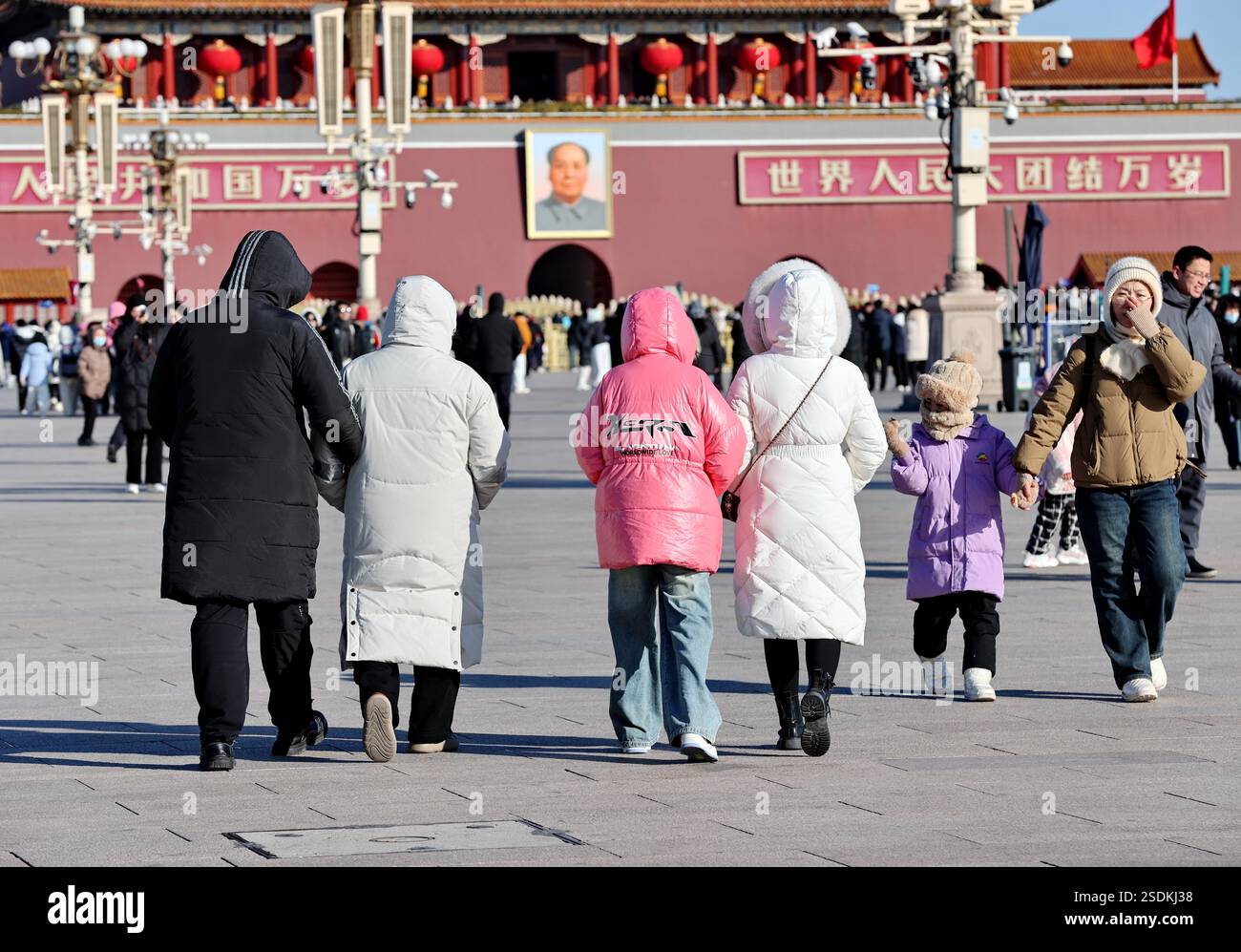 Tourists visit the Tiananmen Square amid cold air in Beijing, China, 3 ...