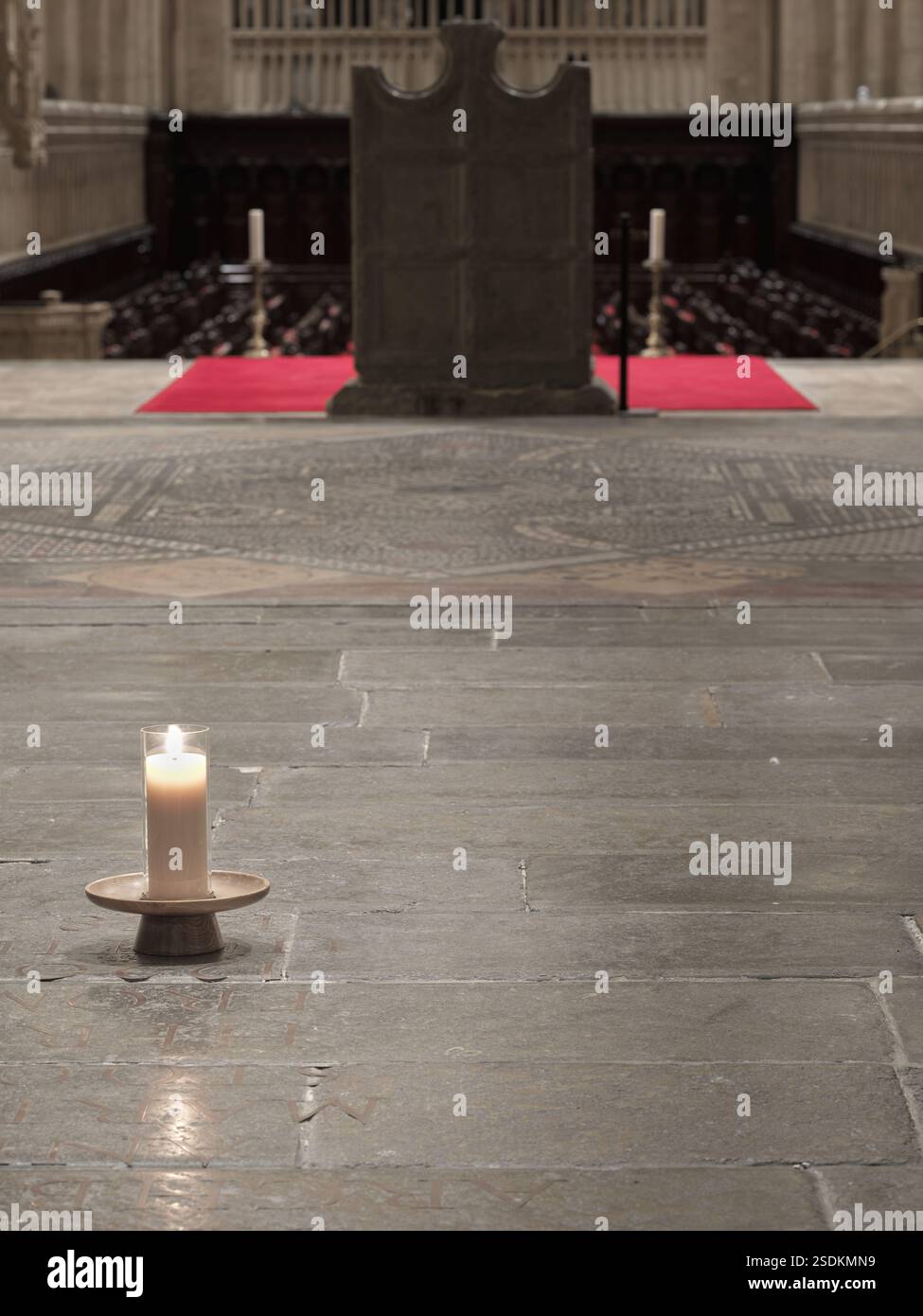 A solitary lit candle marks the former shrine to Thomas A Becket in the ...